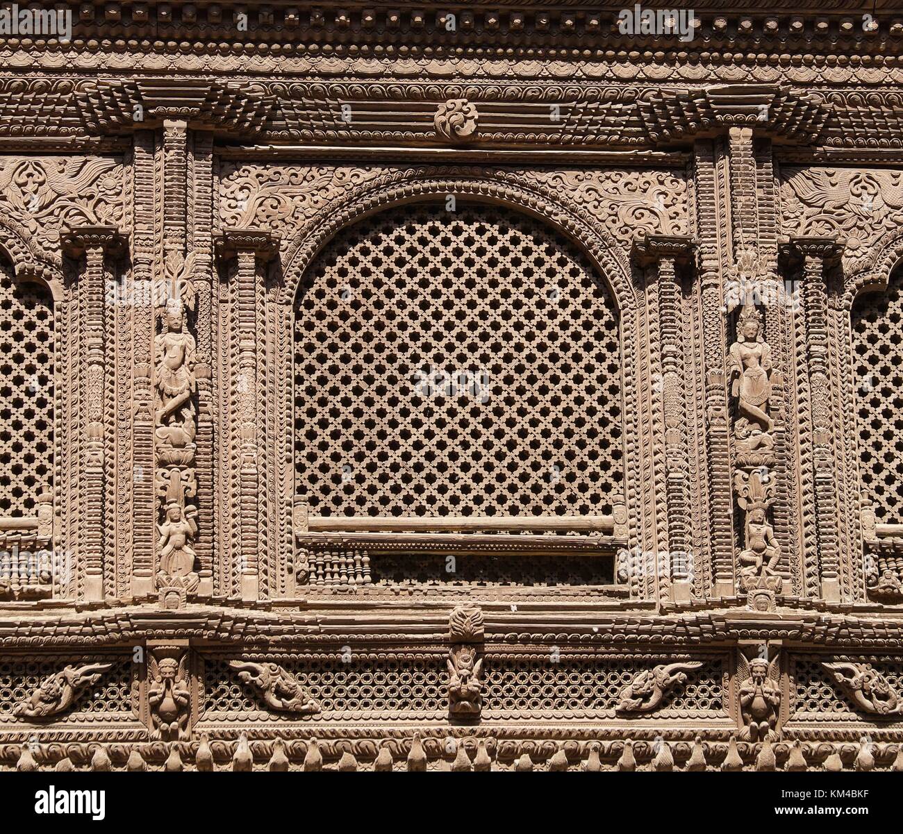 Filigree carvings decorate this precious window at the old royal palace ...