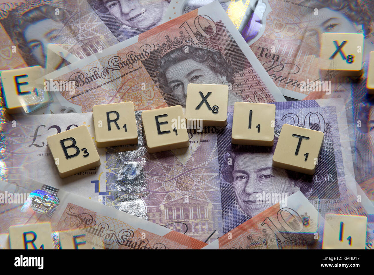 Scrabble letters spelling BREXIT with new British pounds (GBP) £20, £10 ...