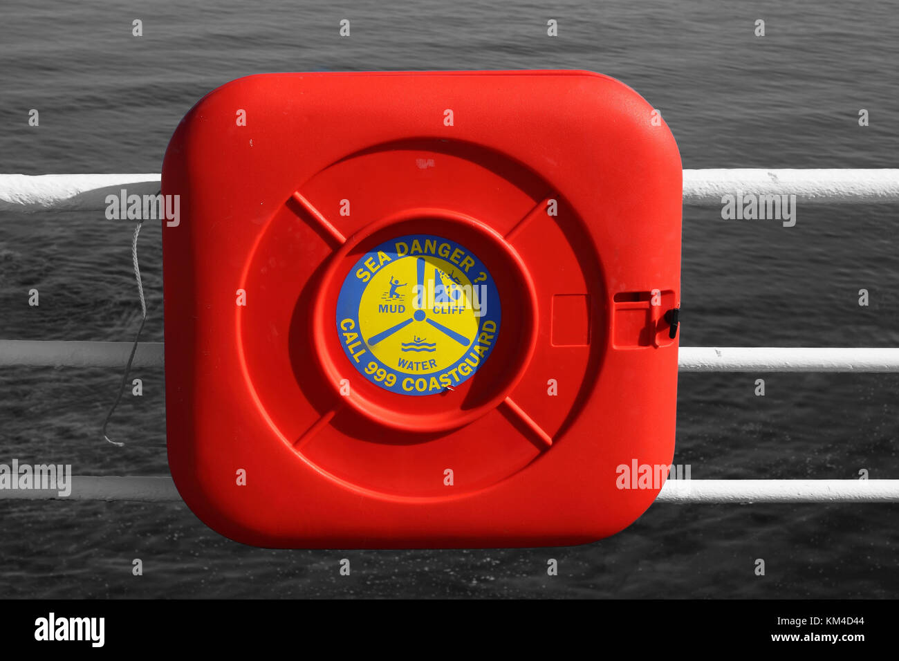 Coastguard safety rescue ring in a box on railings with selective color ...