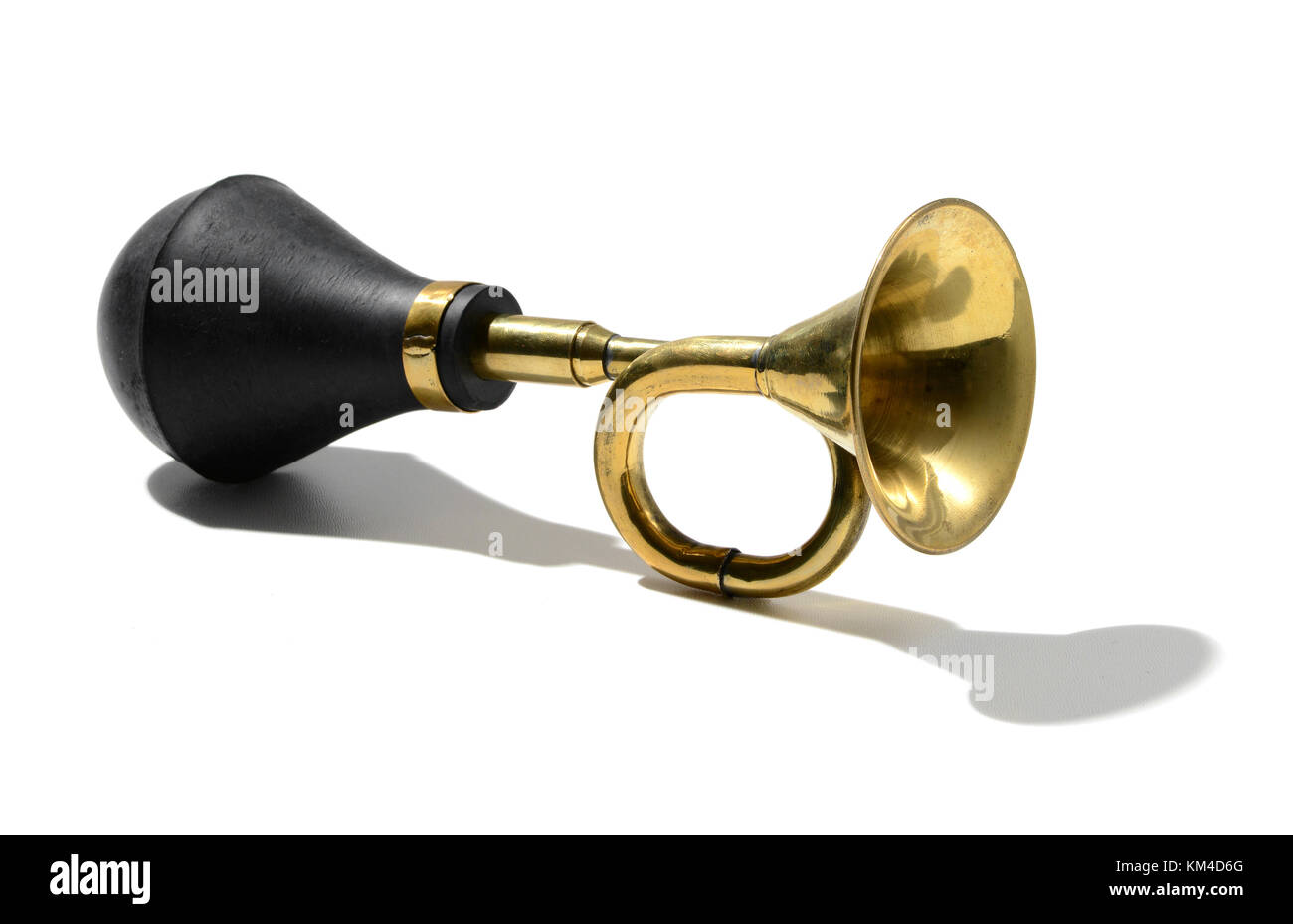 Close up view of vintage brass car horn klaxon or small trumpet against ...