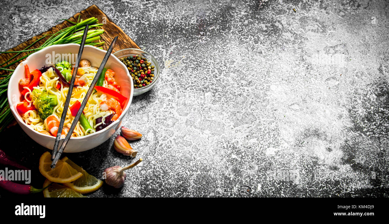 Asian food. Chinese noodles with vegetables. On rustic background Stock ...