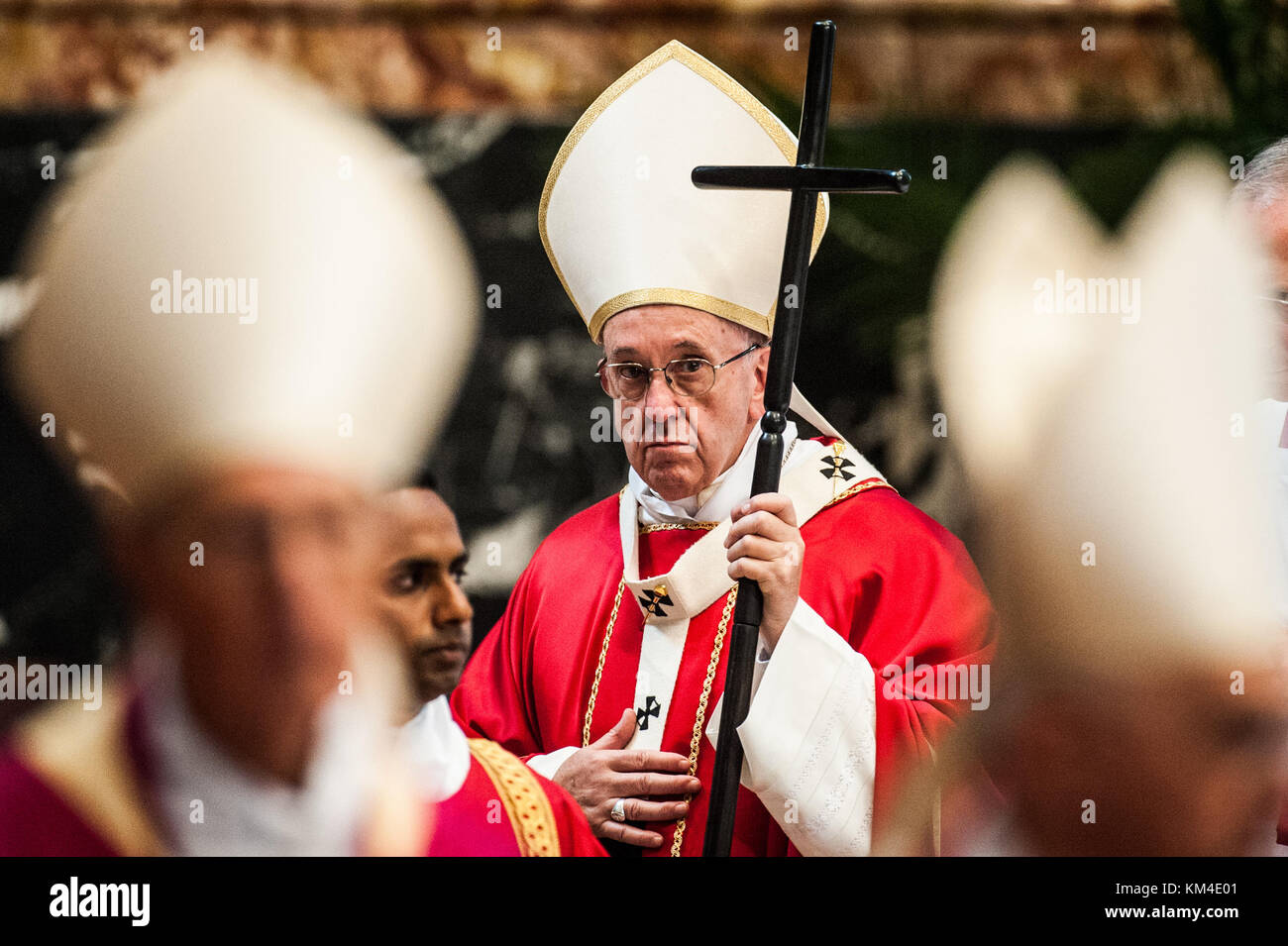 Pope Francis holds the pastoral cross as he leaves the mass for the ...