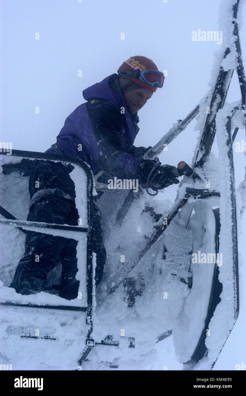 Brian Fishpool an engineering fitter, fixing a frozen ski lift cable ...