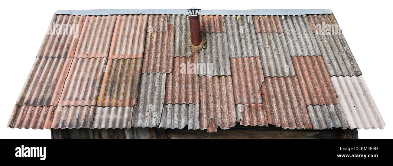 Roof of the simple rural shed is covered with big gray and red aged ...
