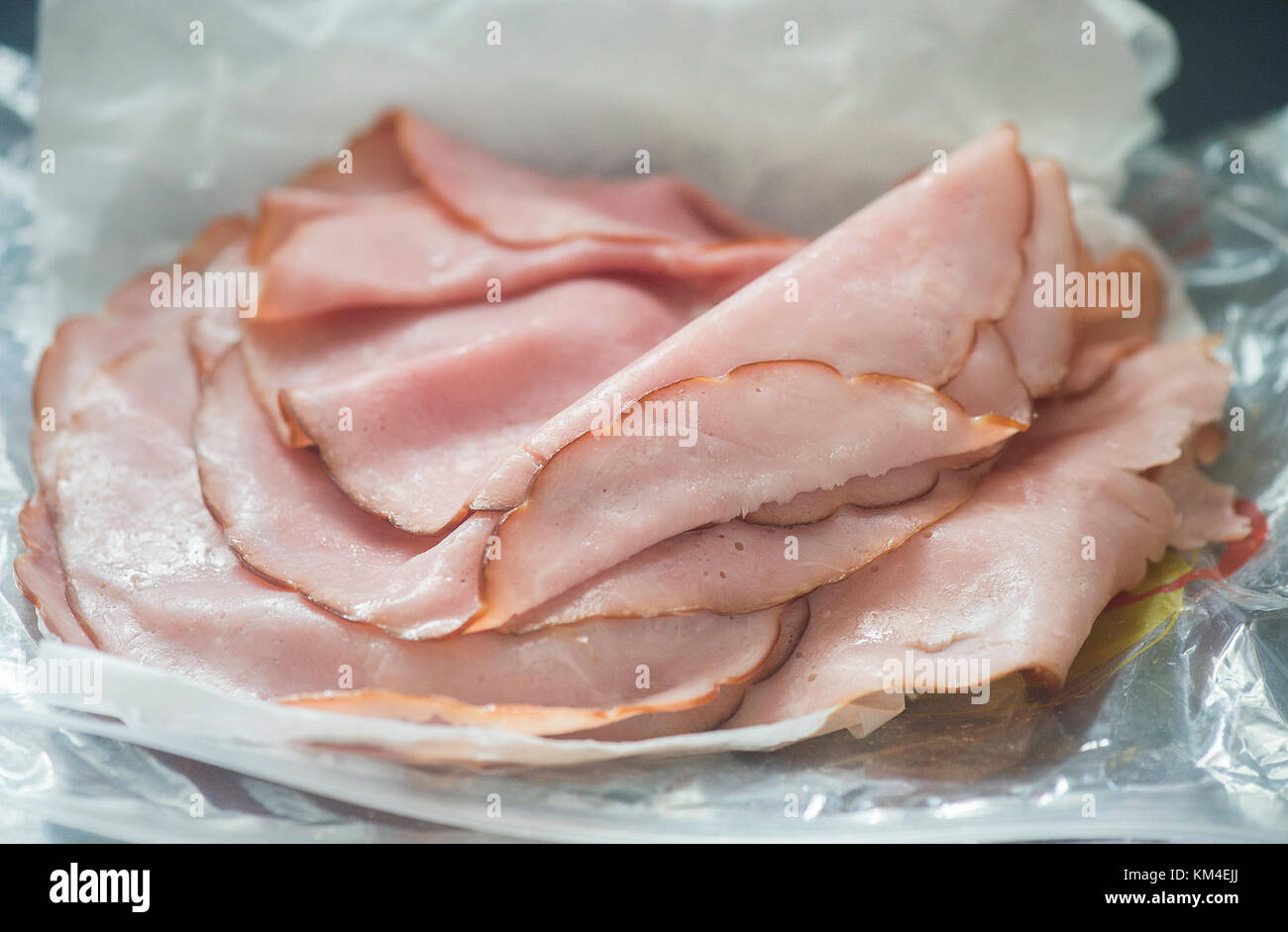 Slices of sandwich ham is shown on wax paper Stock Photo - Alamy