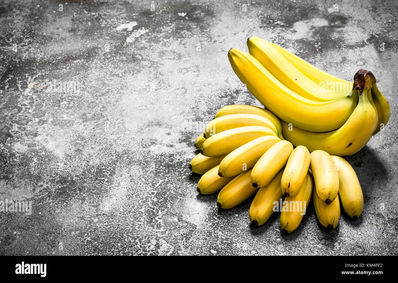 Fresh ripe bananas . On a rustic background Stock Photo - Alamy