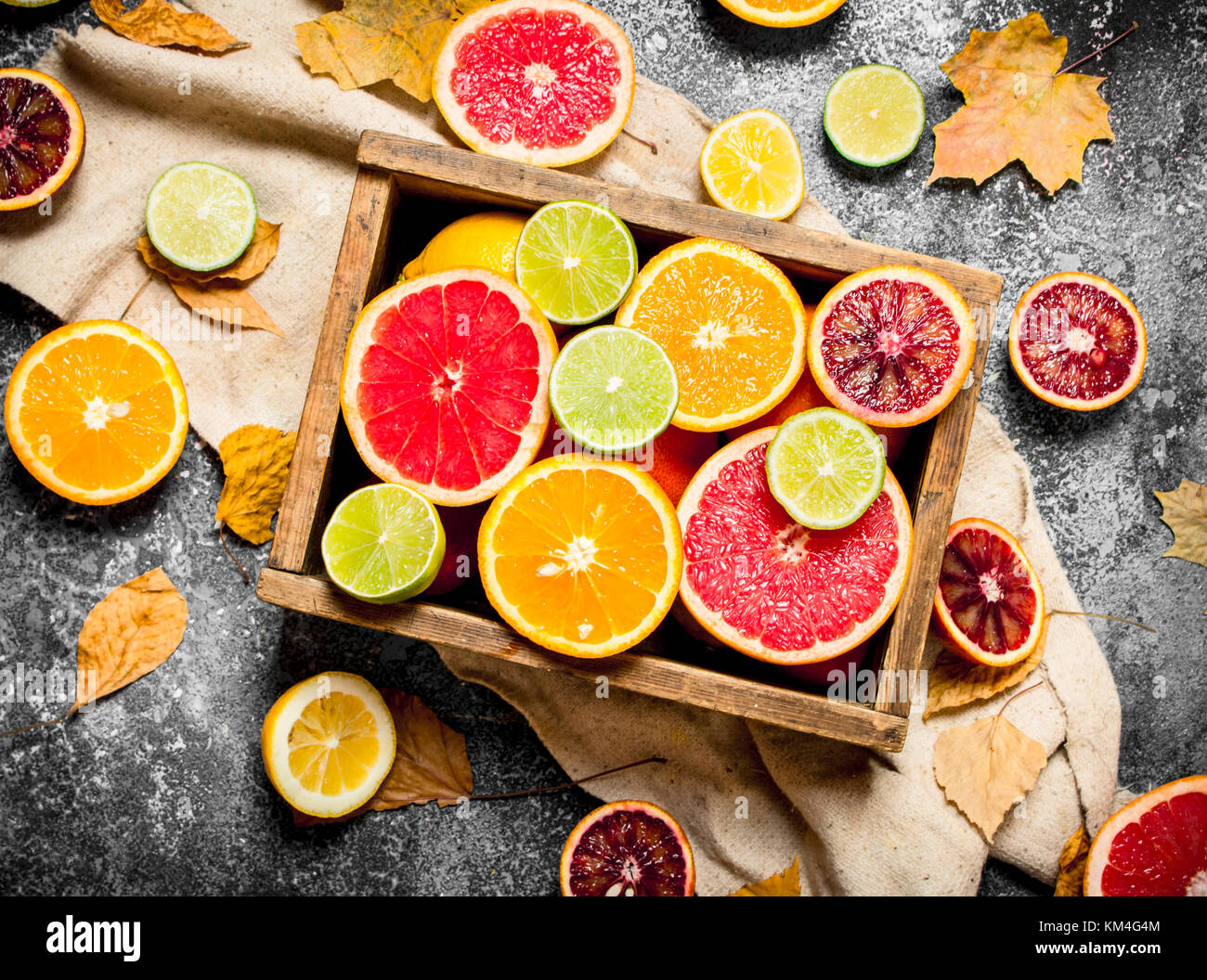 Citrus background. Fresh citrus fruit in an old box. On rustic ...