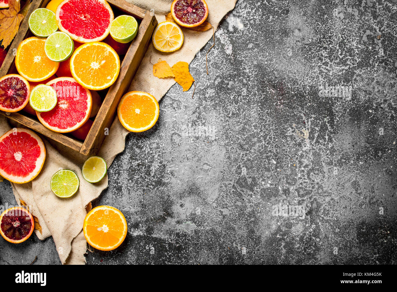 Citrus background. Fresh citrus fruit in an old box. On rustic ...
