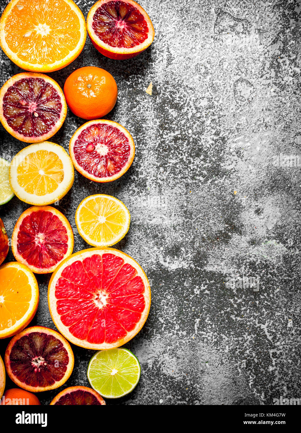 Citrus background. Fresh citrus fruit. On rustic background Stock Photo ...