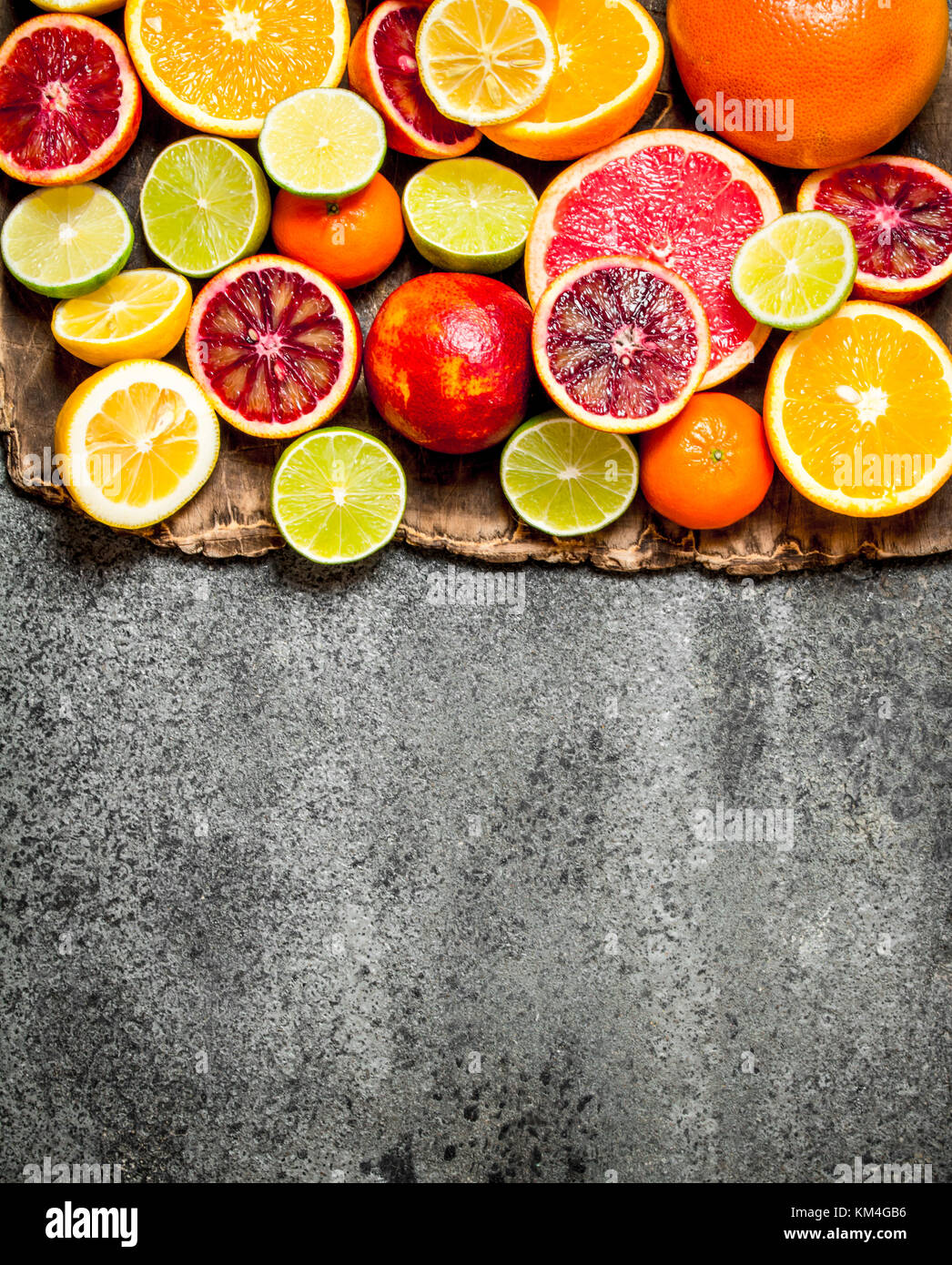 Citrus background. Fresh citrus fruit. On rustic background Stock Photo ...