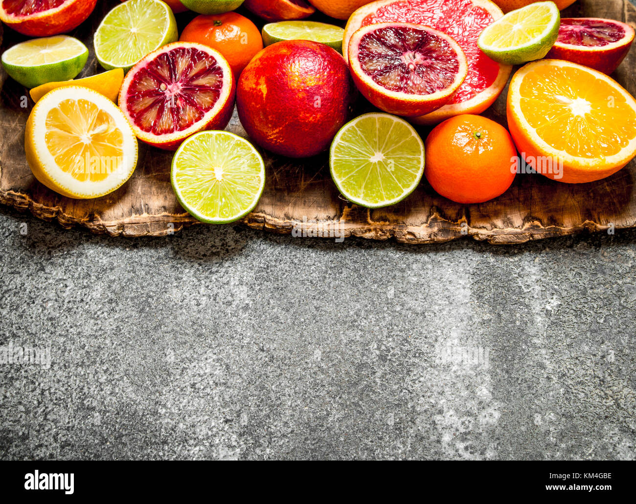 Citrus background. Fresh citrus fruit. On rustic background Stock Photo ...