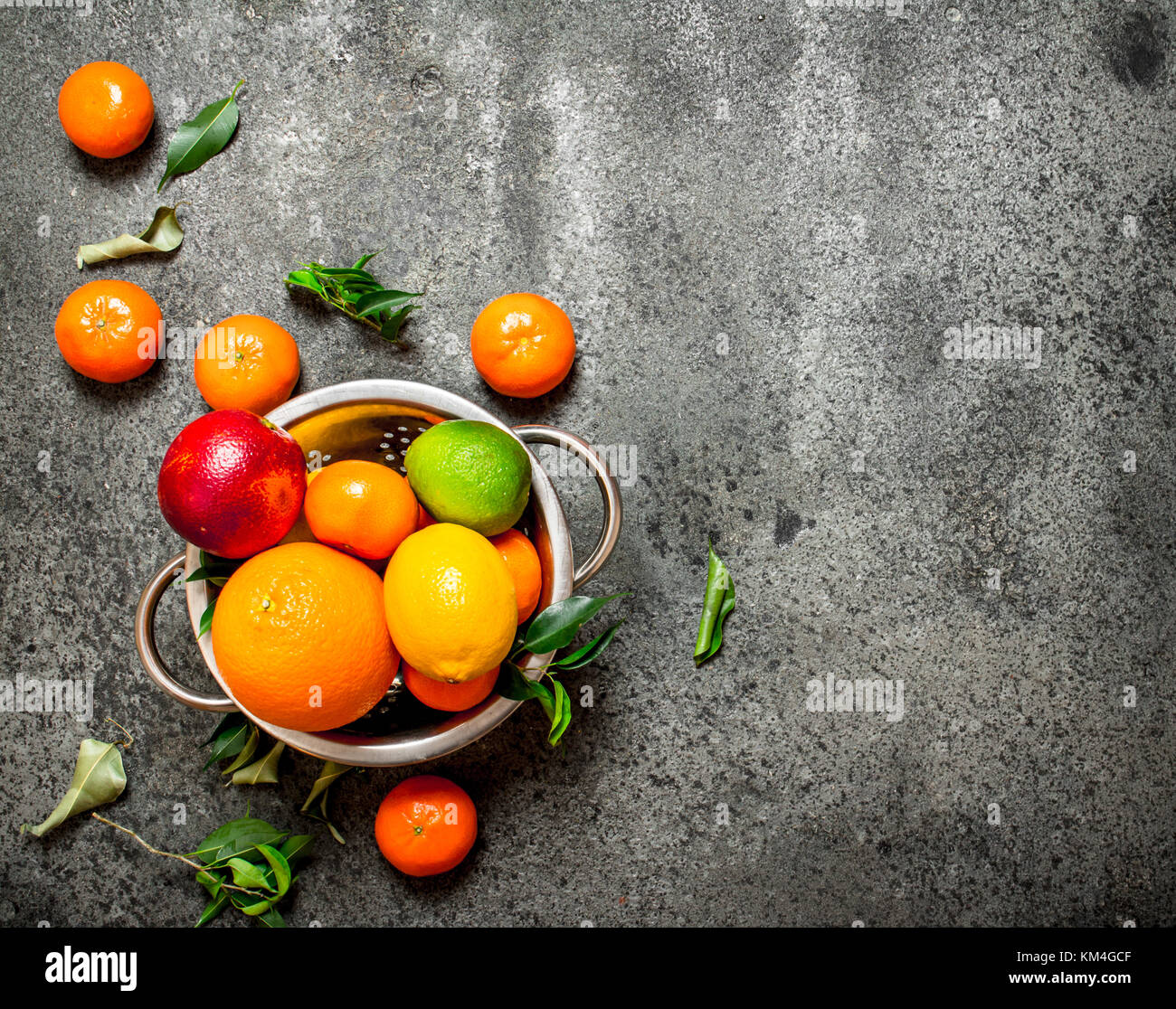 Fresh citrus fruit in a bowl. On rustic background Stock Photo - Alamy