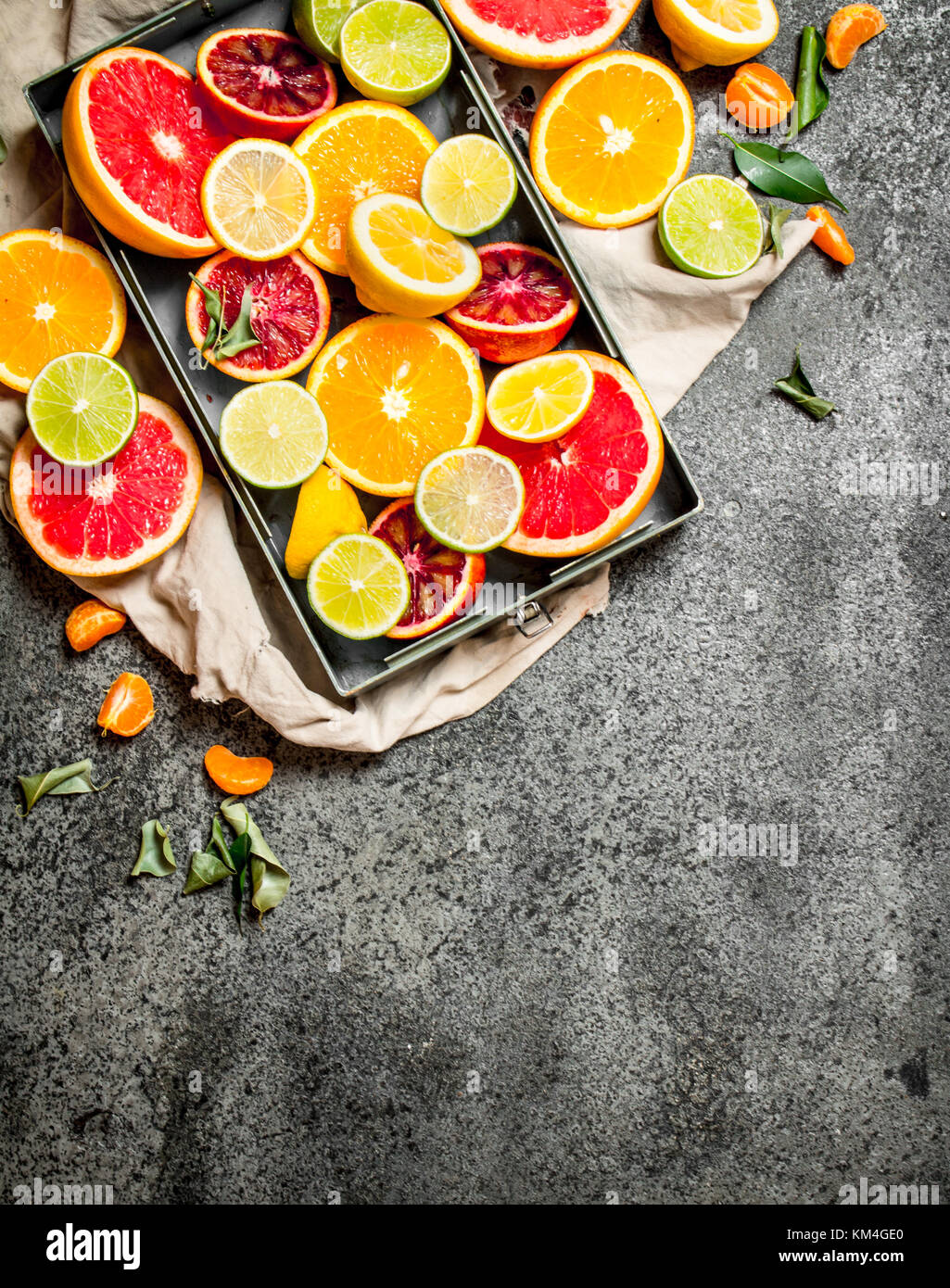 Fresh citrus fruit in the box. On rustic background Stock Photo - Alamy