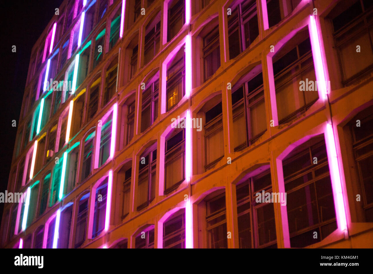 Illuminated building at night with fancy lights Stock Photo - Alamy