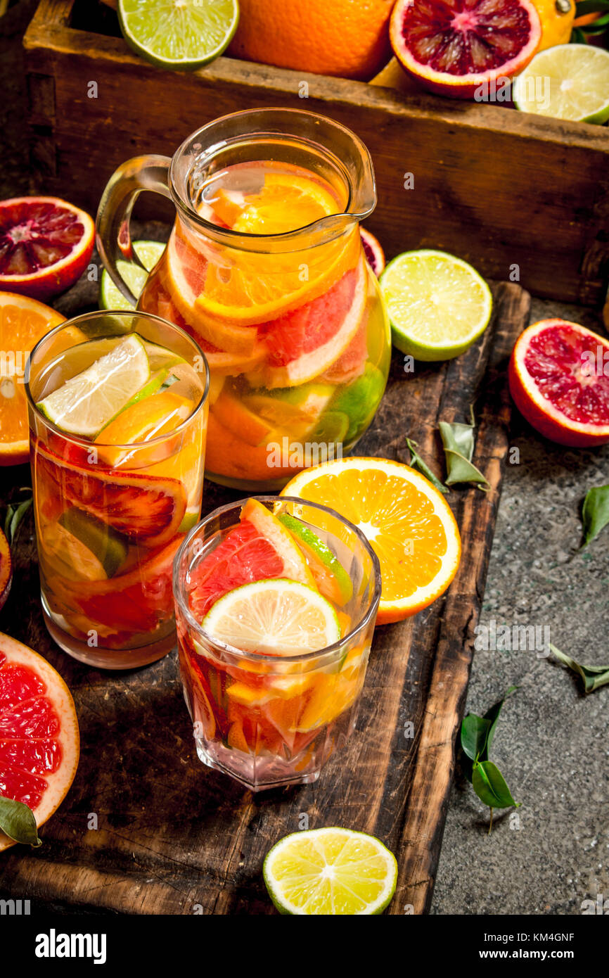 Fresh juice from citrus fruits. On rustic background Stock Photo - Alamy