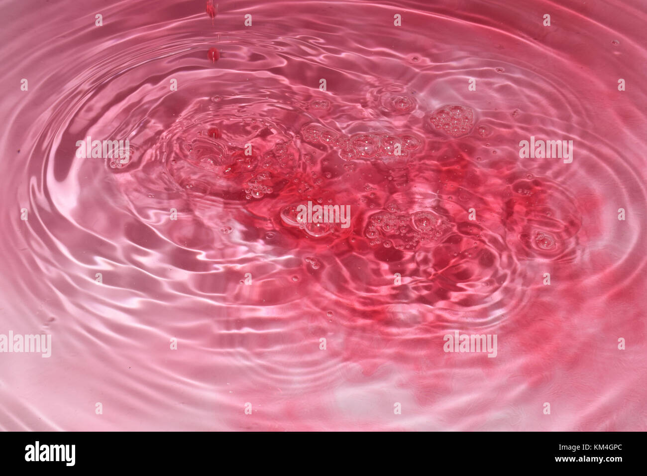 Bath water dyed pink with blackcurrant juice Stock Photo - Alamy