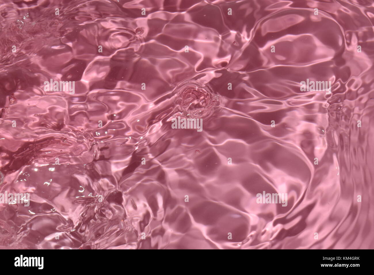 Bath water dyed pink with blackcurrant juice Stock Photo - Alamy