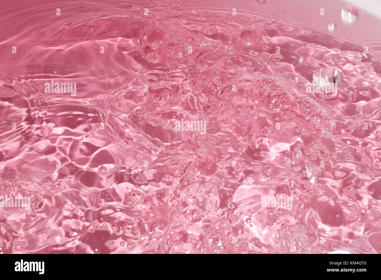 Bath water dyed pink with blackcurrant juice Stock Photo - Alamy