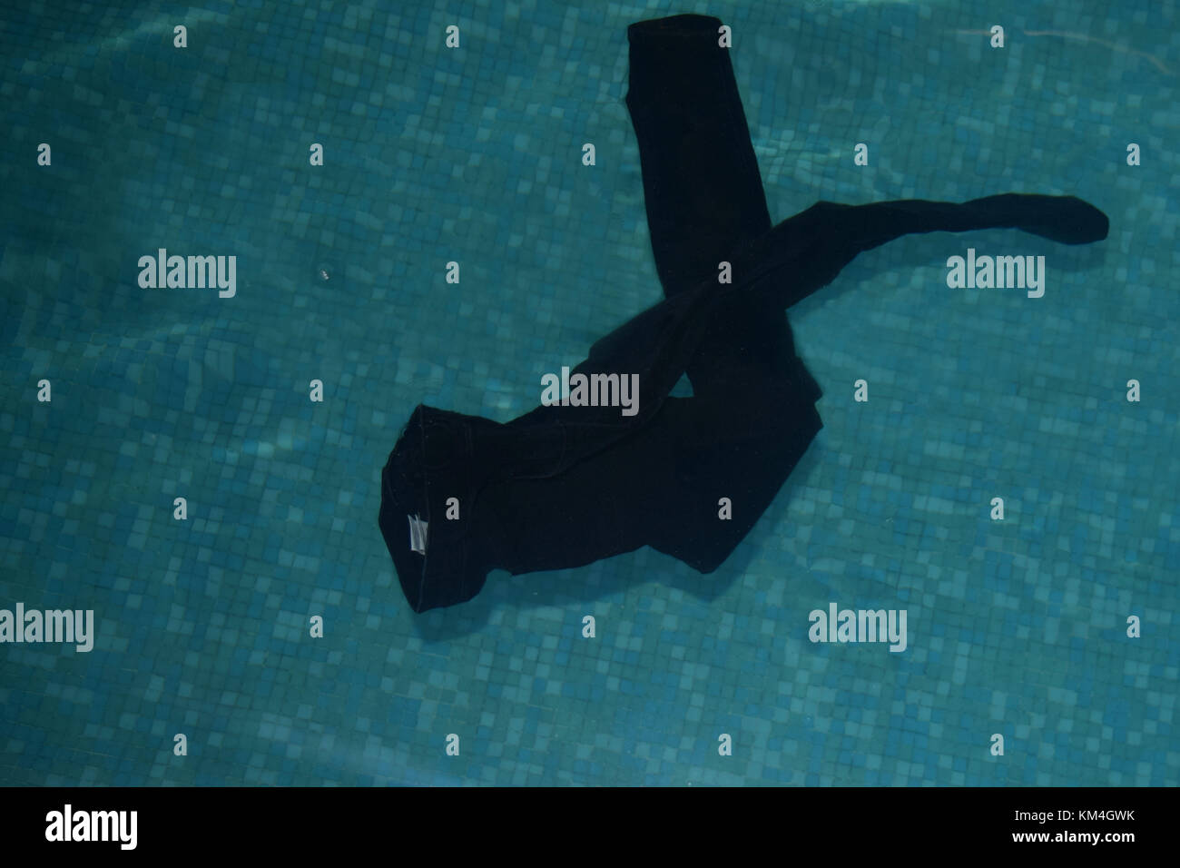 Clothes sinking in a swimming pool to represent the people that have ...