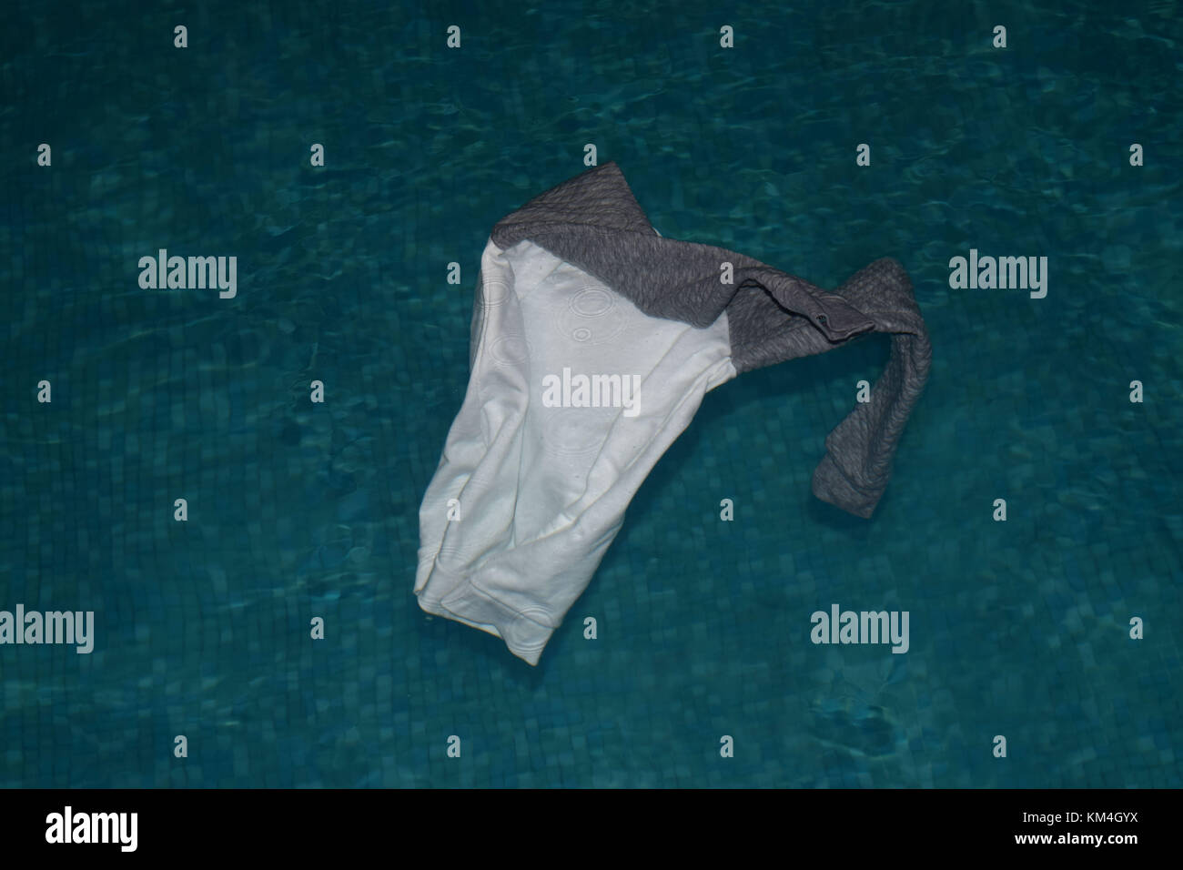 Clothes sinking in a swimming pool to represent the people that have ...