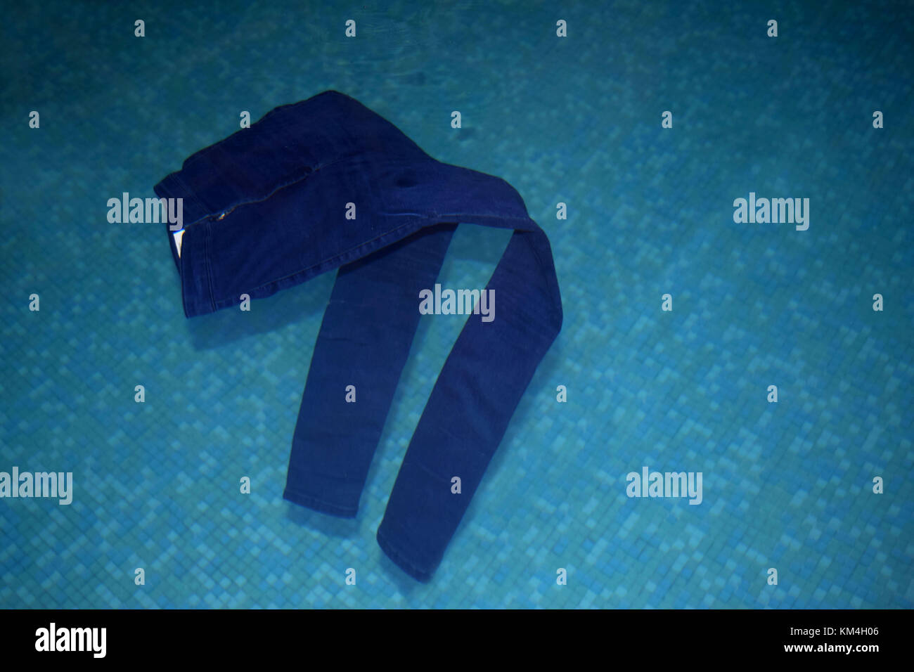 Clothes sinking in a swimming pool to represent the people that have ...