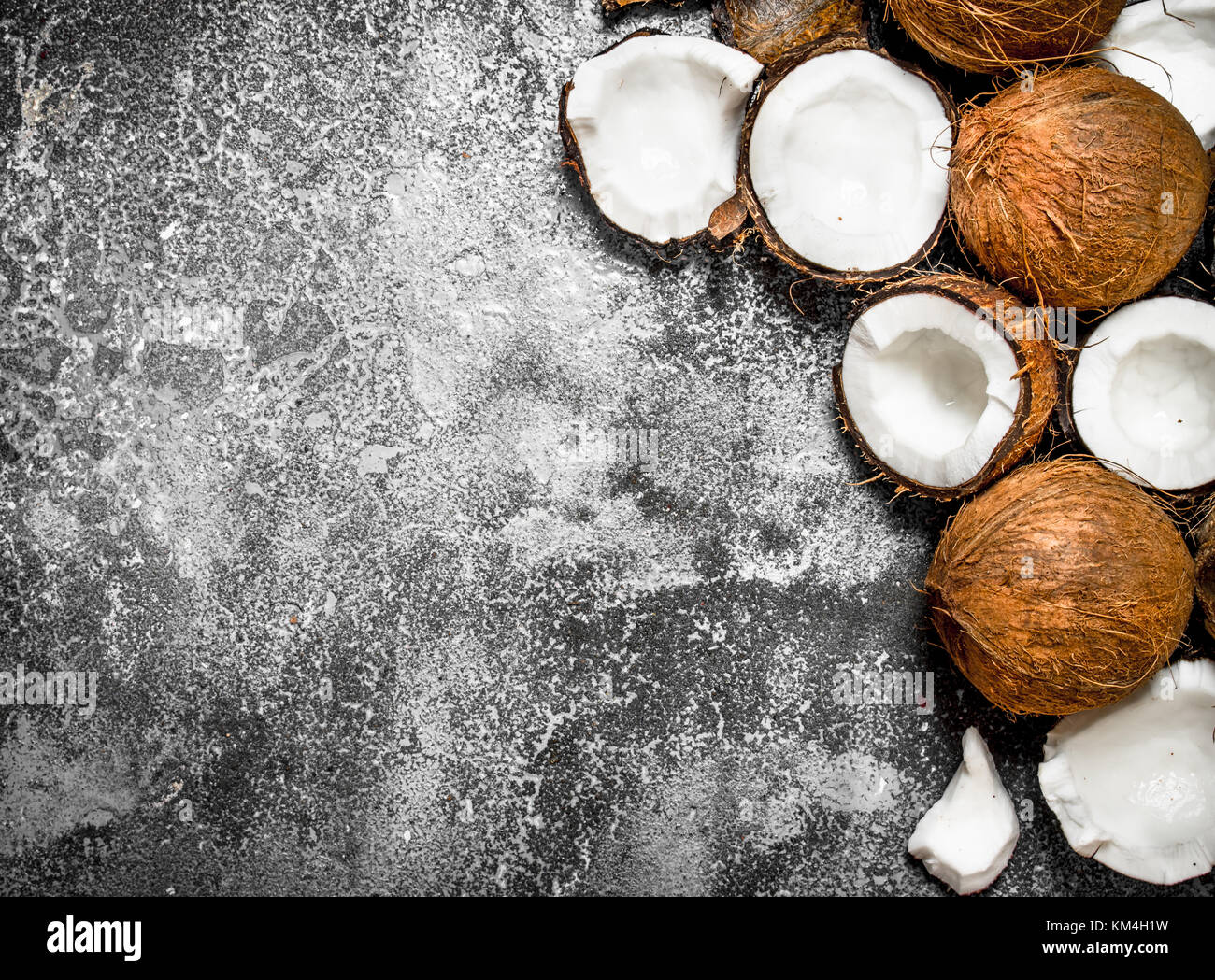 Fresh ripe coconuts. On a rustic background Stock Photo - Alamy