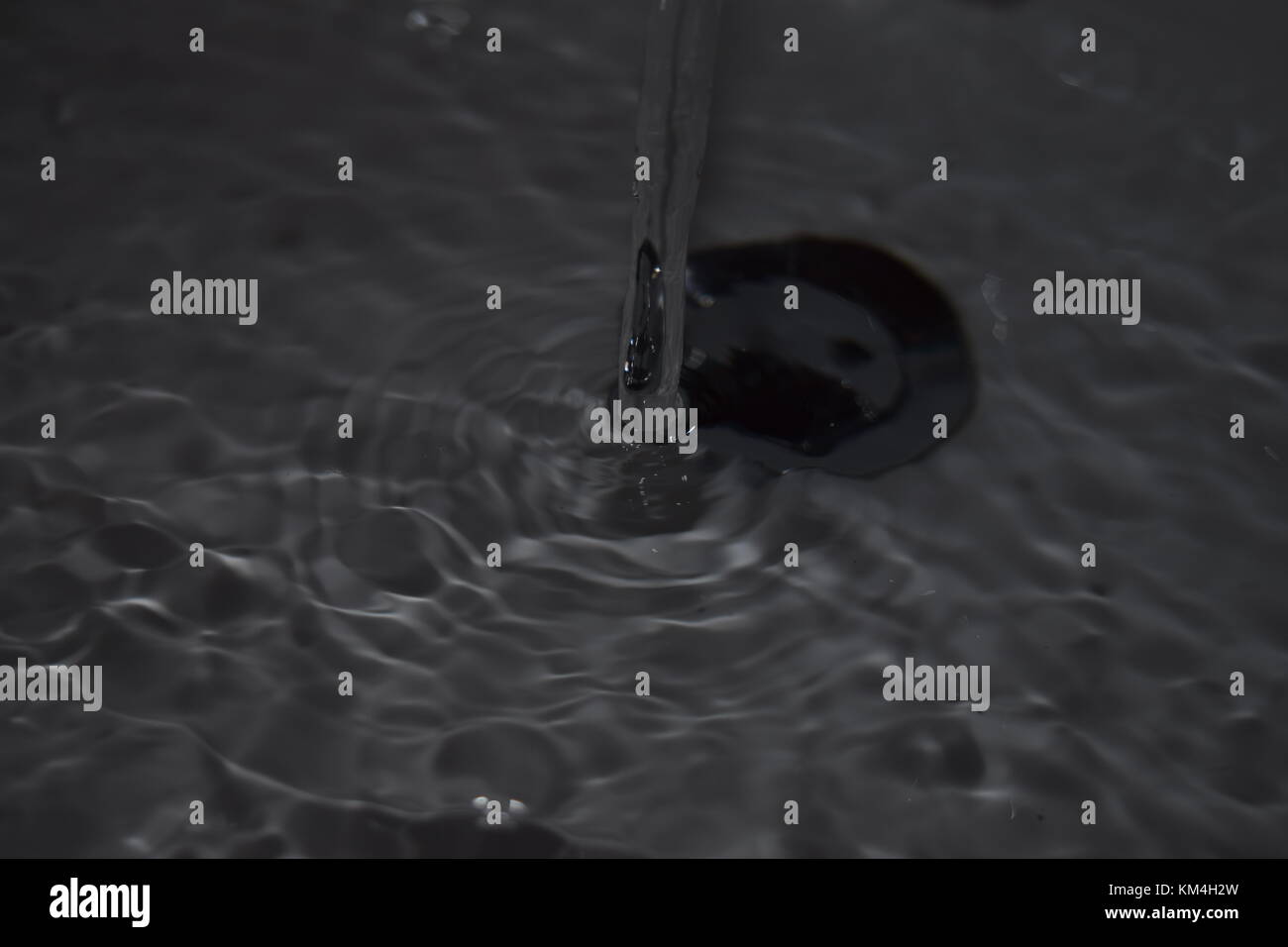 Running water into a sink Stock Photo - Alamy