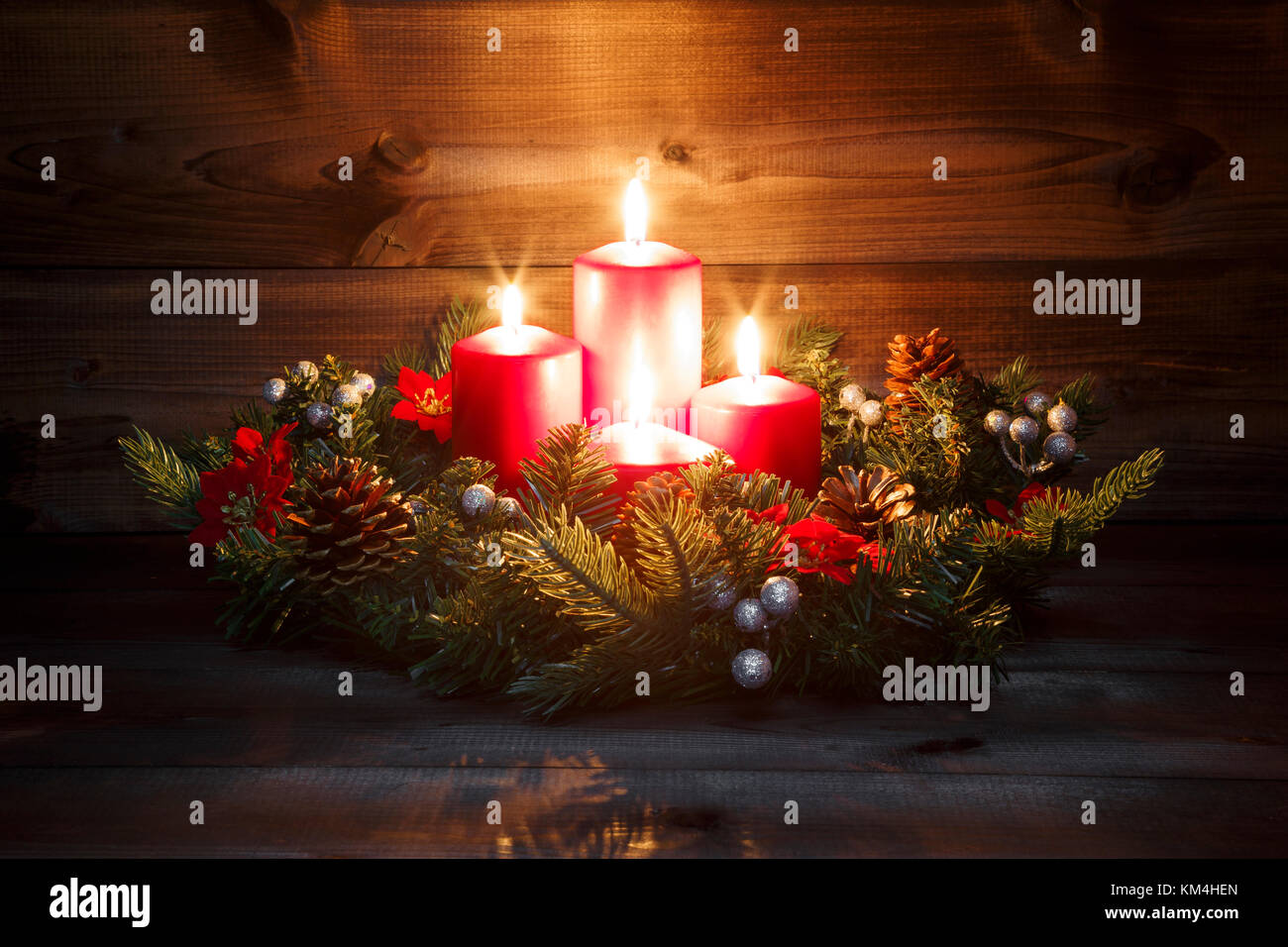 Fourth Advent - Decorated Advent wreath with four red burning candles ...