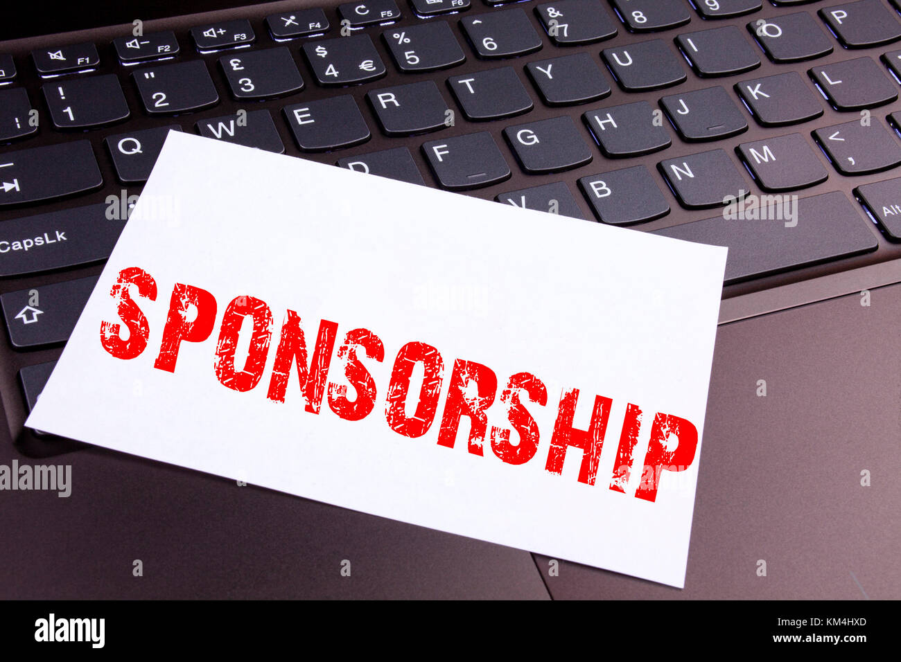 Writing Sponsorship text made in the office close-up on laptop computer ...
