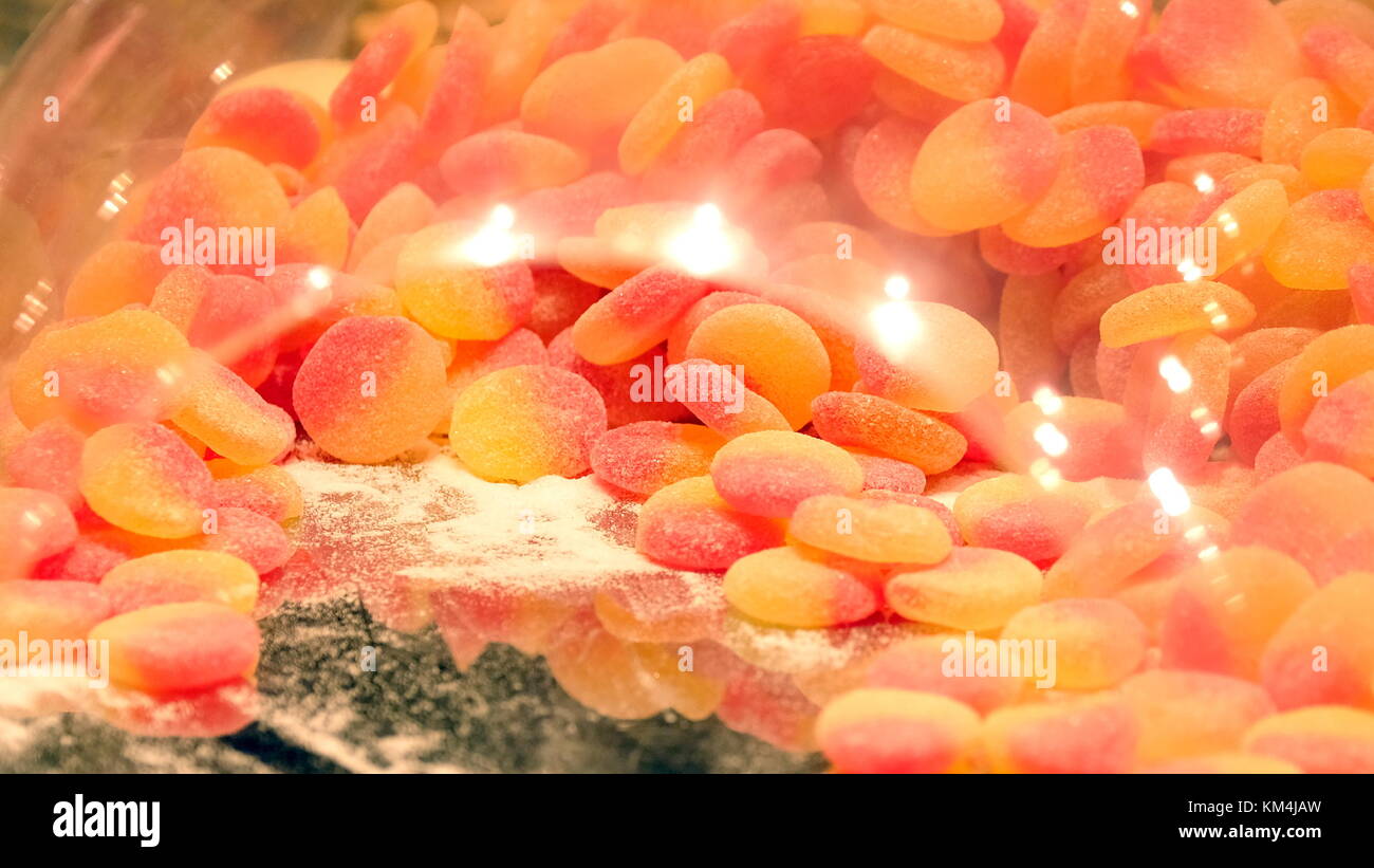 Display of traditional confectionary, yellow and red with sugar coated ...