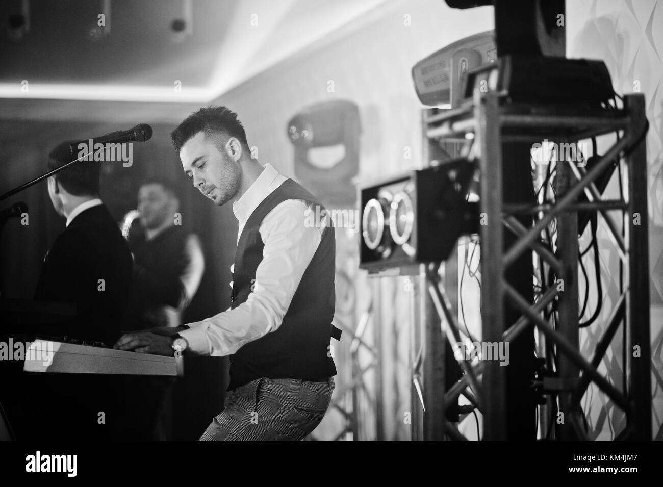 Musicial music live band performing on a stage with different lights ...