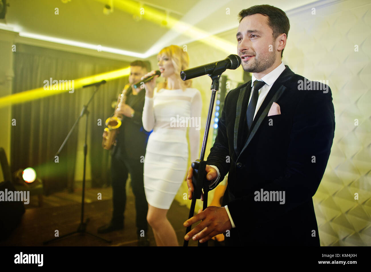 Musicial music live band performing on a stage with different lights ...