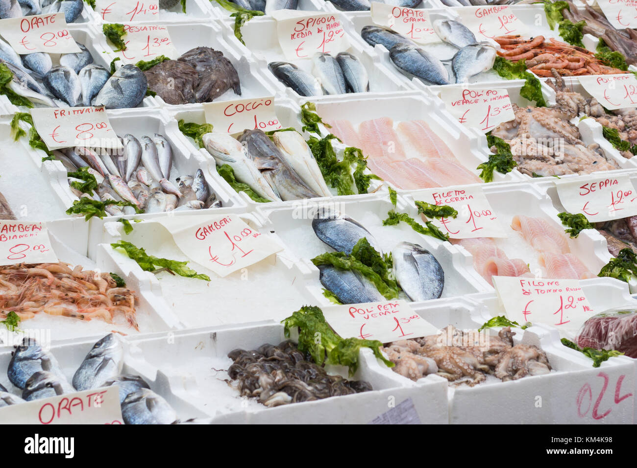 Fish stands in the open market of the historical streets of Naples in ...