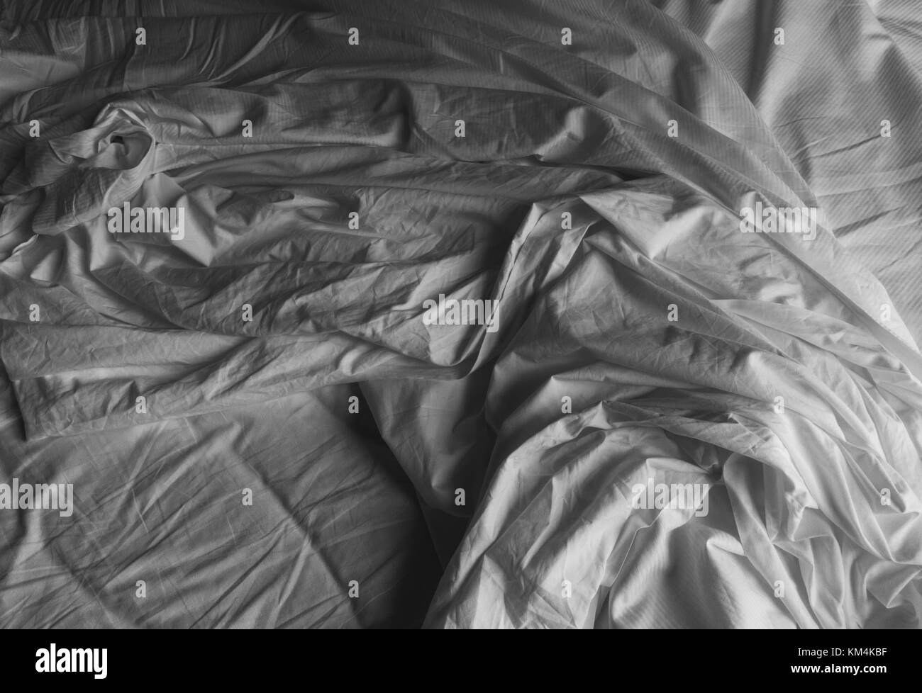 Black and white close up of wrinkled cotton sheets on bed Stock Photo ...