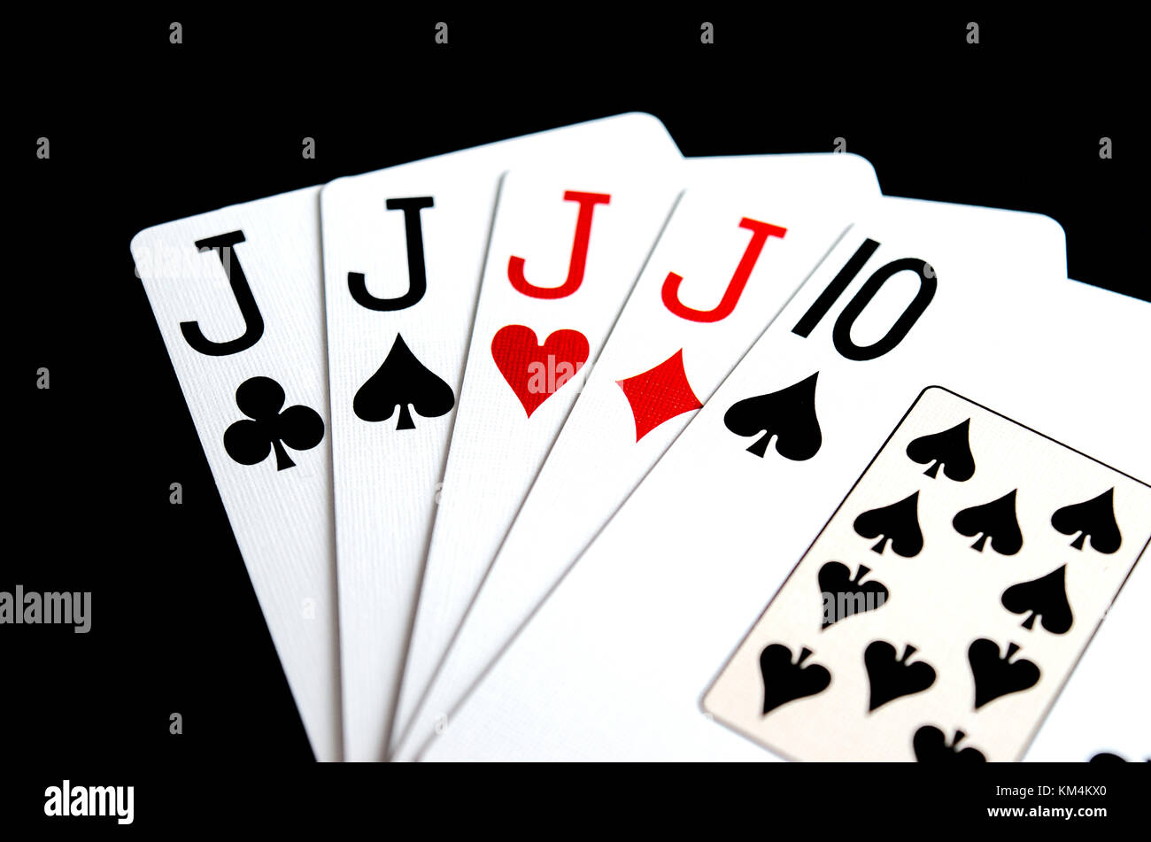 Poker Hand Four of a Kind on Black Background Stock Photo - Alamy