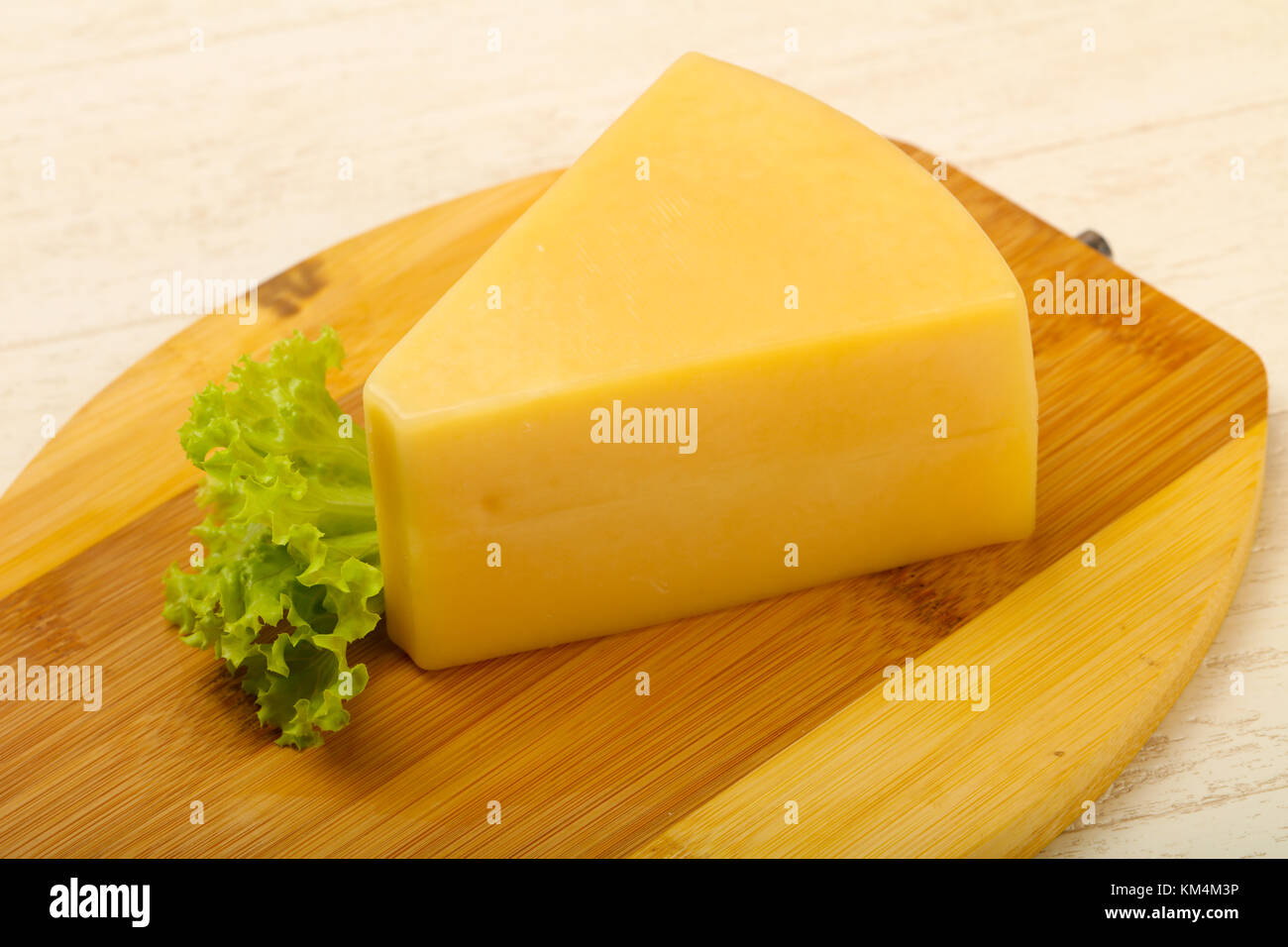 Parmesan cheese triangle Stock Photo - Alamy