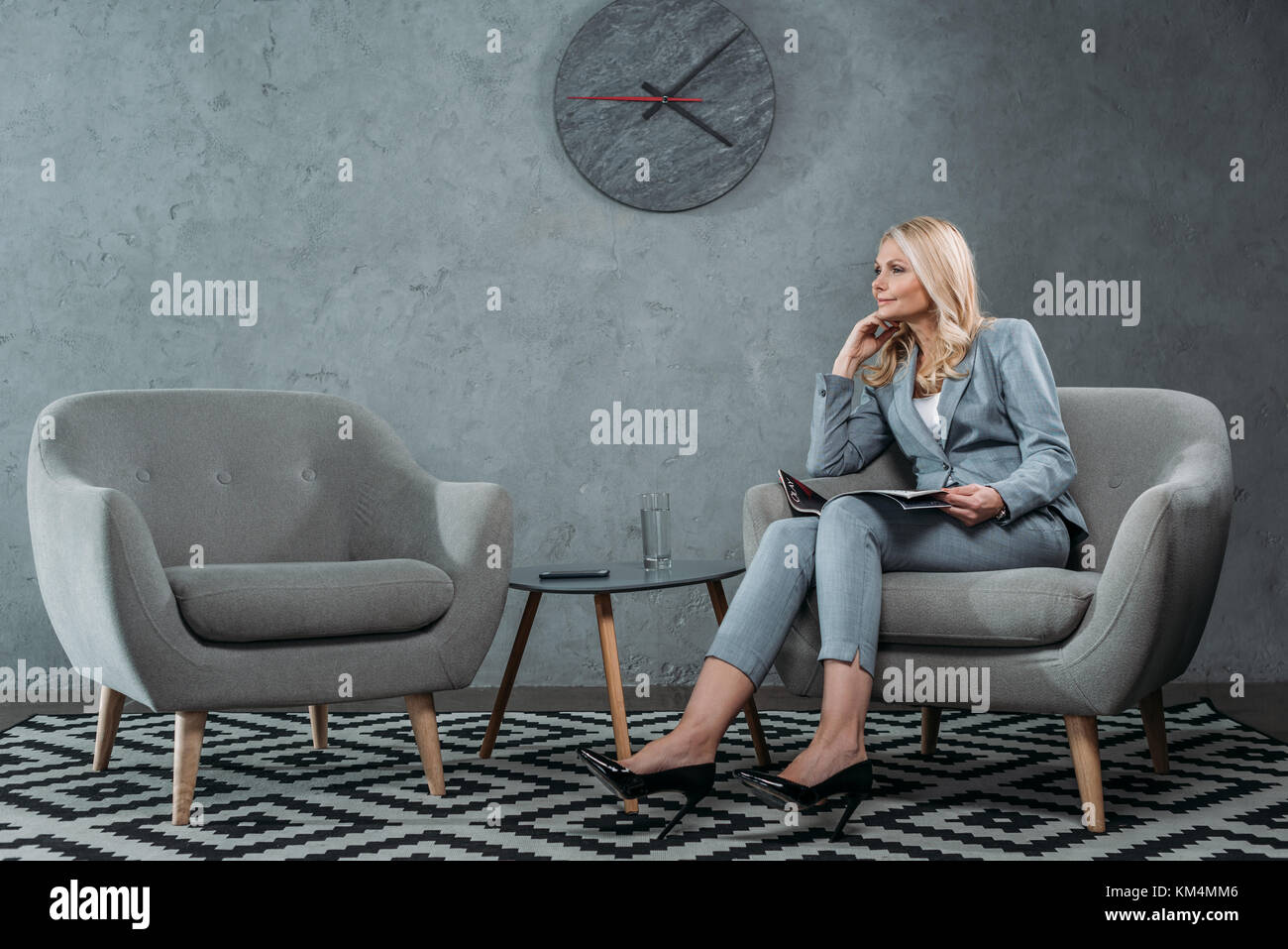 Happy female professional sitting hi-res stock photography and images ...