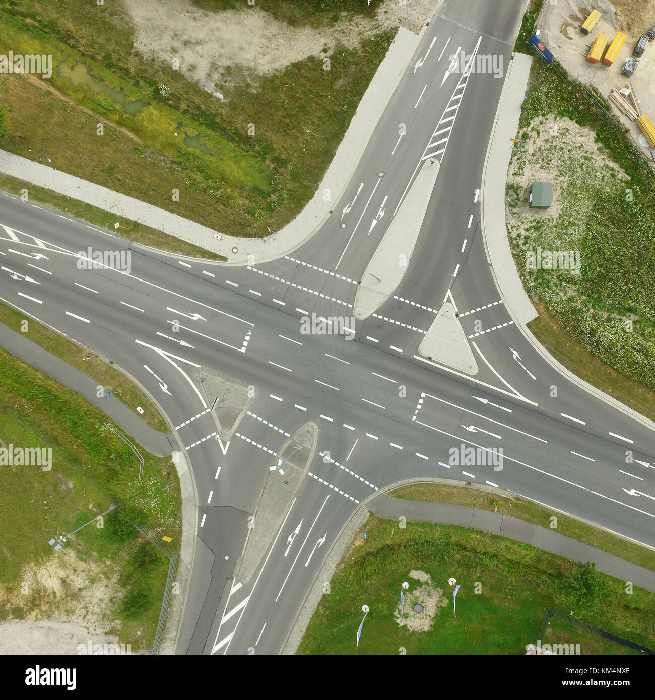 Empty crossroads with icons to the lanes, perpendicular to the drone ...