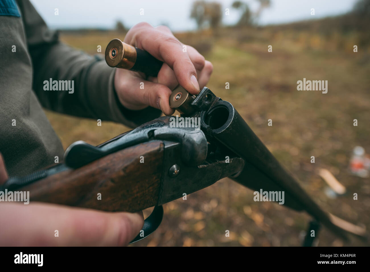hunter loading gun with bullets Stock Photo - Alamy