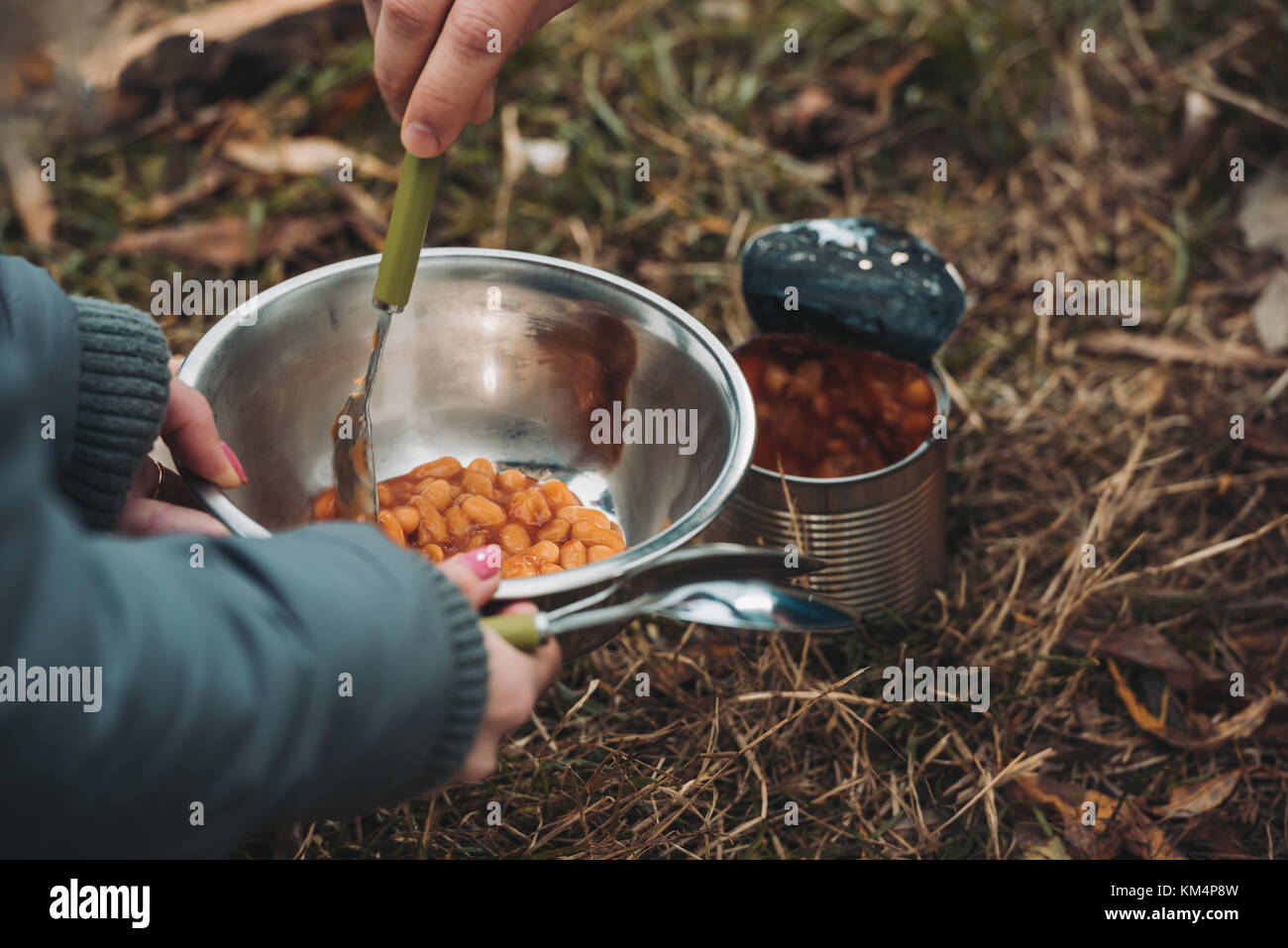 Man and woman preparing to eat beans Stock Photo - Alamy