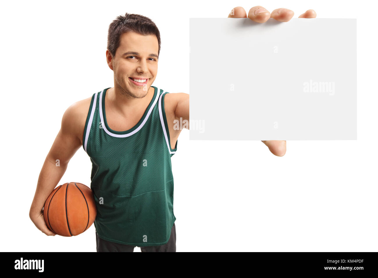 Basketball player showing a blank card and smiling isolated on white ...