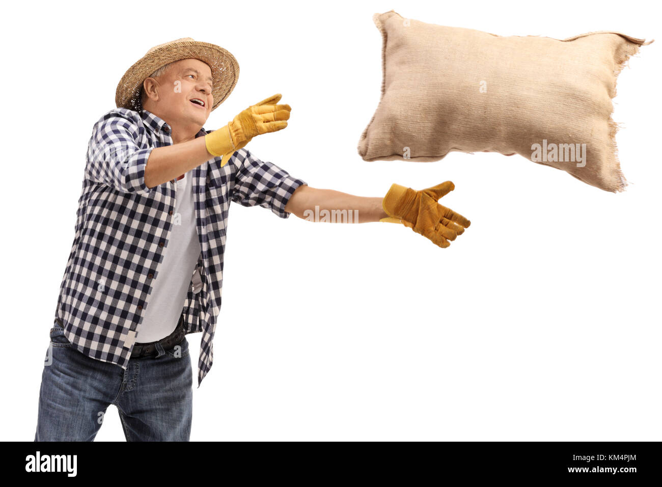 Farmer throwing a burlap sack isolated on white background Stock Photo ...