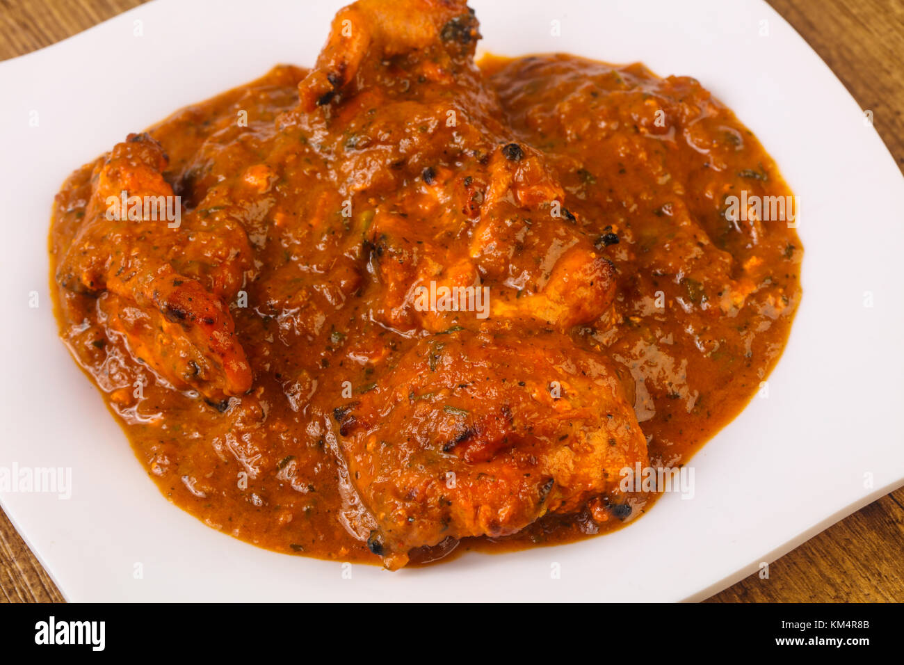 Indian traditional cuisine - Masala chicken with spices Stock Photo - Alamy