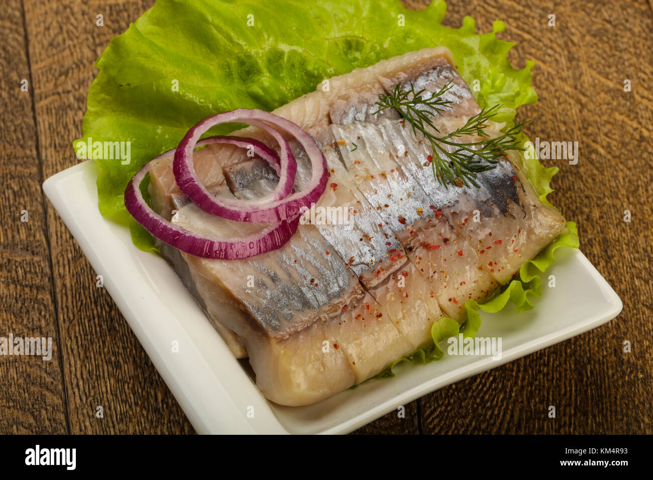 Sliced Herring fillet with dill and onion Stock Photo - Alamy