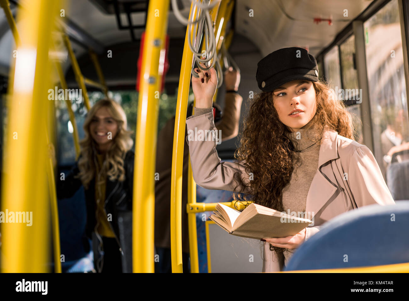 girl reading book in bus Stock Photo - Alamy