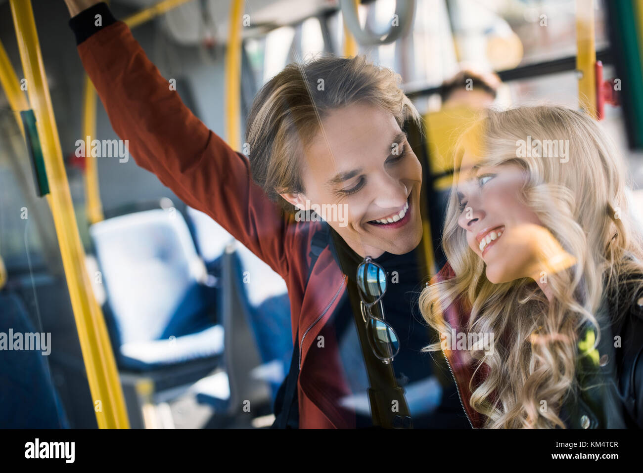 happy young couple in bus Stock Photo - Alamy