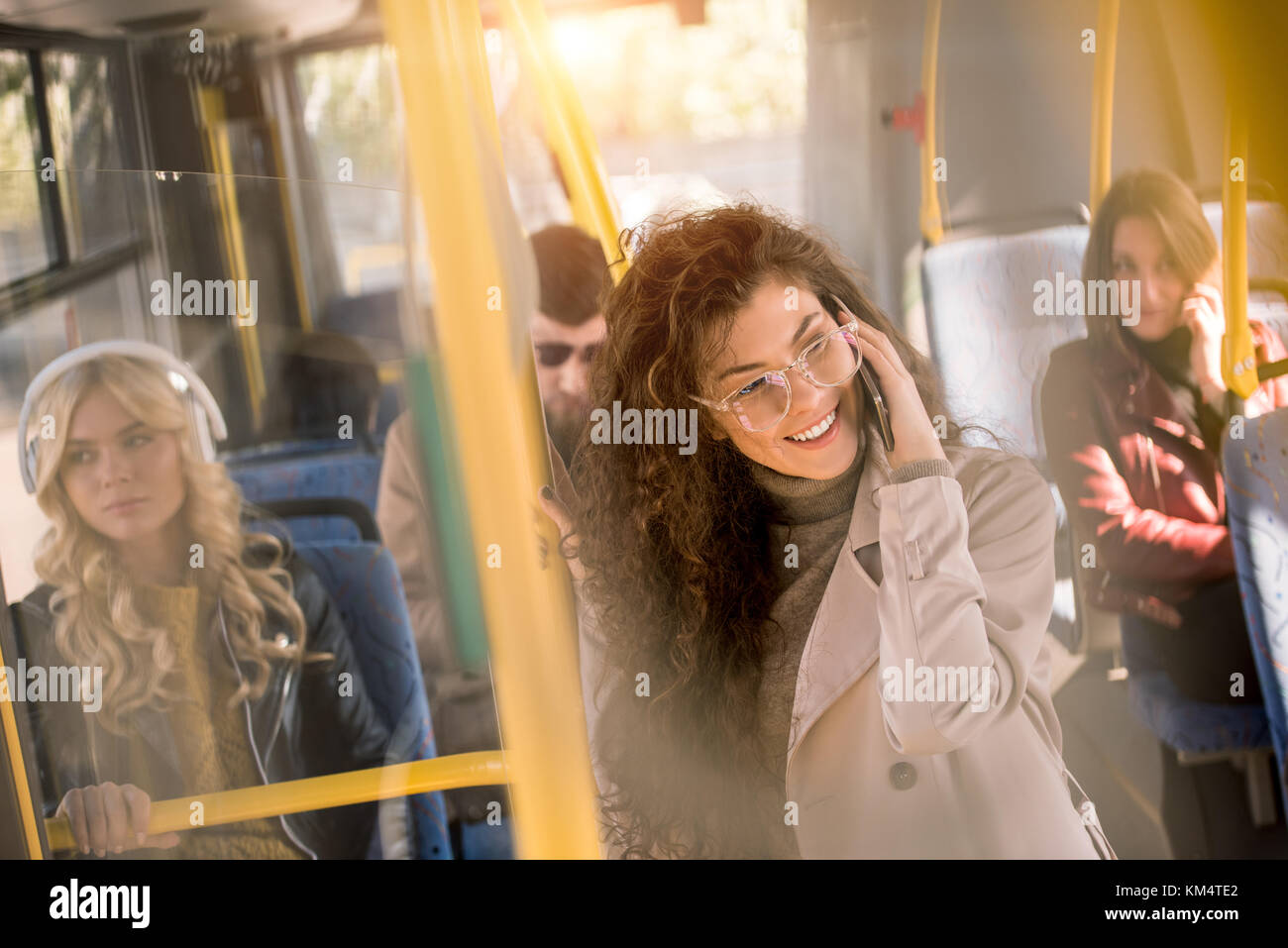 girl using smartphone in bus Stock Photo - Alamy