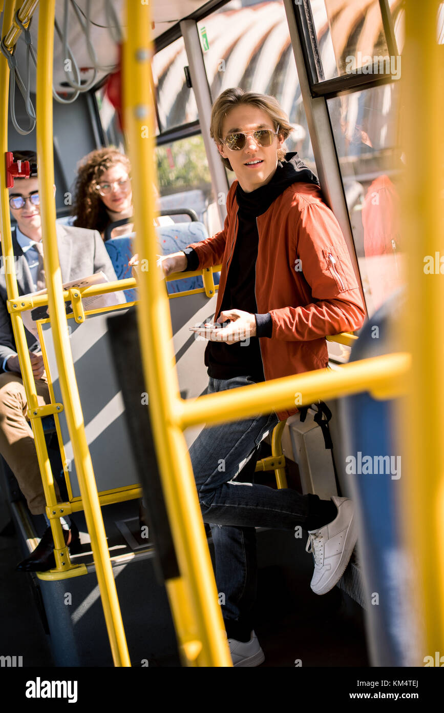 man using smartphone in bus Stock Photo - Alamy