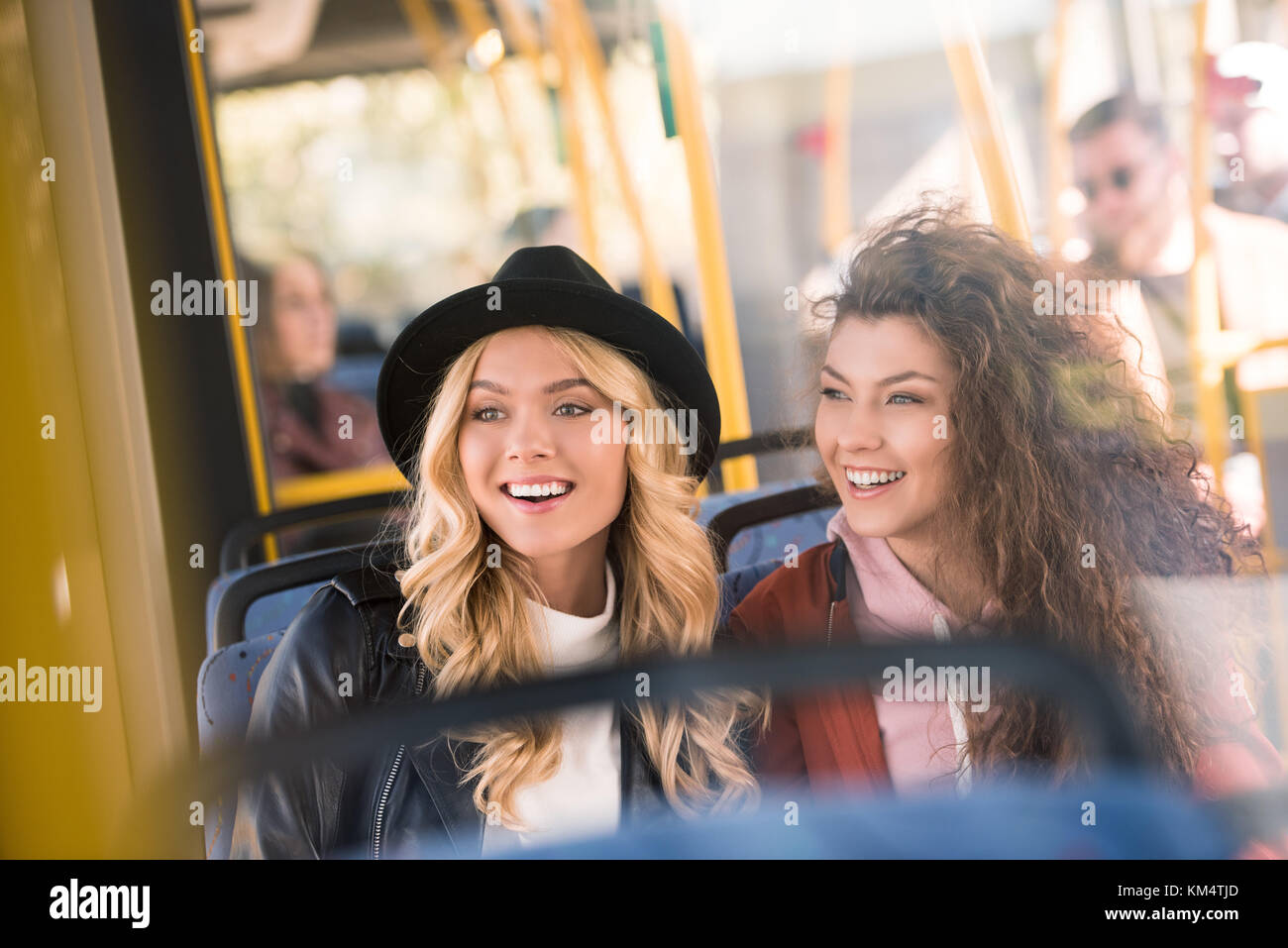 happy girls in bus Stock Photo - Alamy