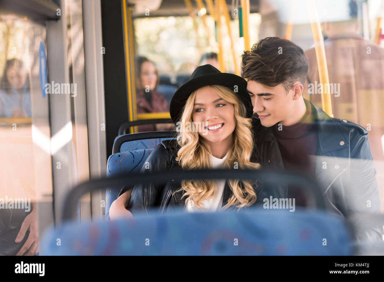 happy young couple in bus Stock Photo - Alamy